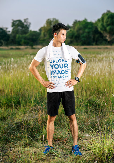 Placeit - Heathered T-Shirt Mockup of a Fitness Man Getting Ready to Run