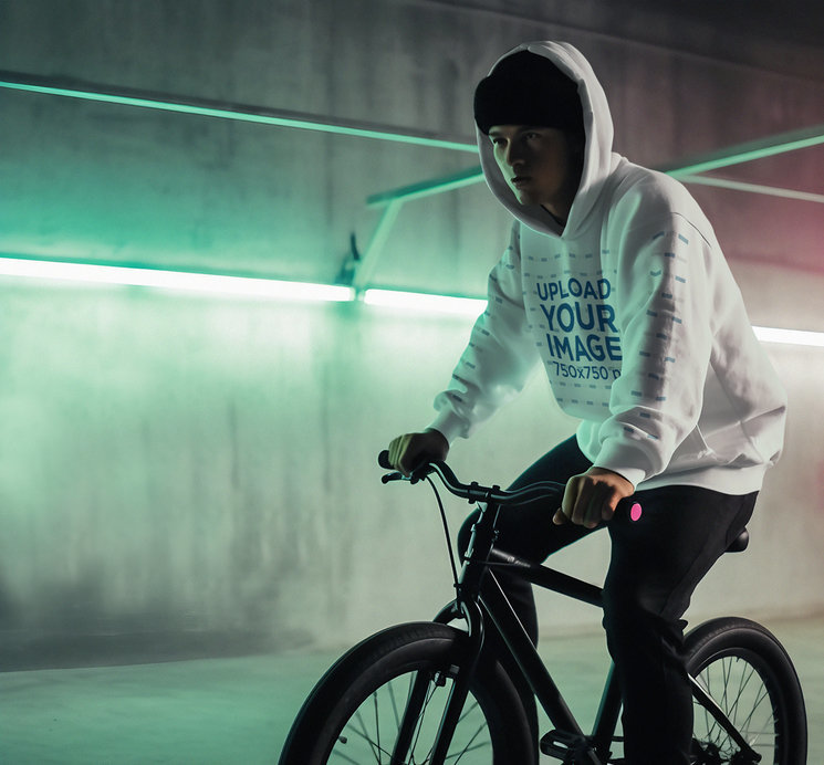 Placeit - Hoodie Mockup Featuring an AI-Generated Man Riding a Bike