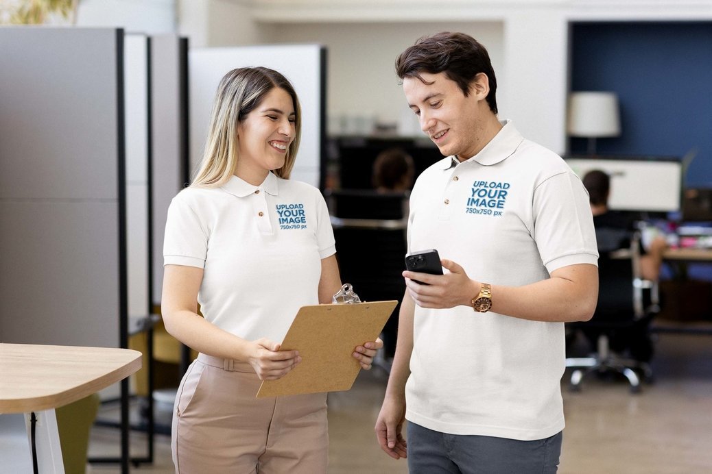 Placeit - Polo Shirt Mockup of Two Coworkers Talking in an Office
