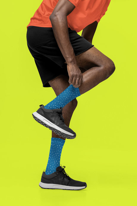 Placeit - Mockup of a Man Pulling His Socks in a Studio