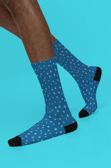 Placeit - Mockup of a Man Wearing Sublimated Socks in a Studio