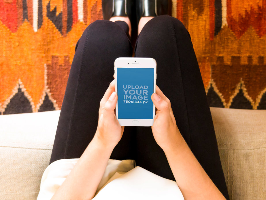 Placeit - iPhone Template of Woman Using iPhone 6 at the Living Room