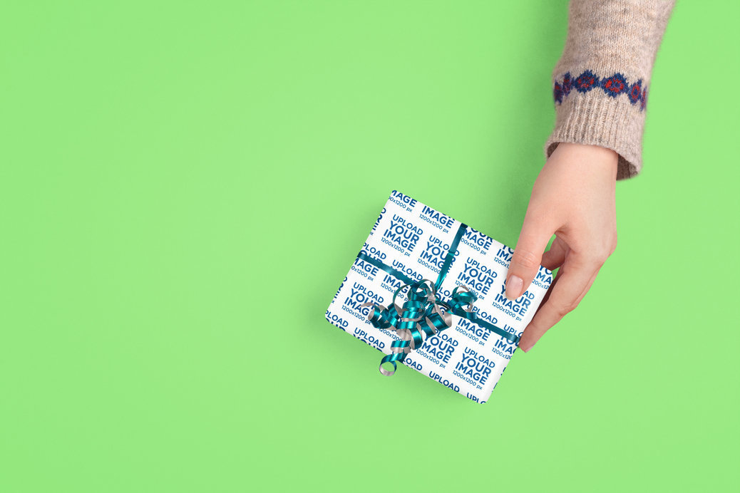 Placeit - Wrapping Paper Mockup Featuring a Woman Holding a Small Gift
