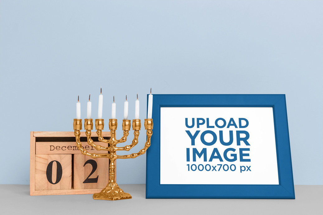 Placeit - Hanukkah-Themed Mockup Featuring an Art Print and a Menorah