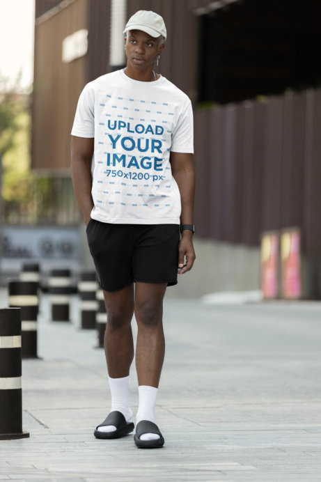 Placeit - Stanley Stella T-Shirt Mockup Featuring a Man Walking by the ...