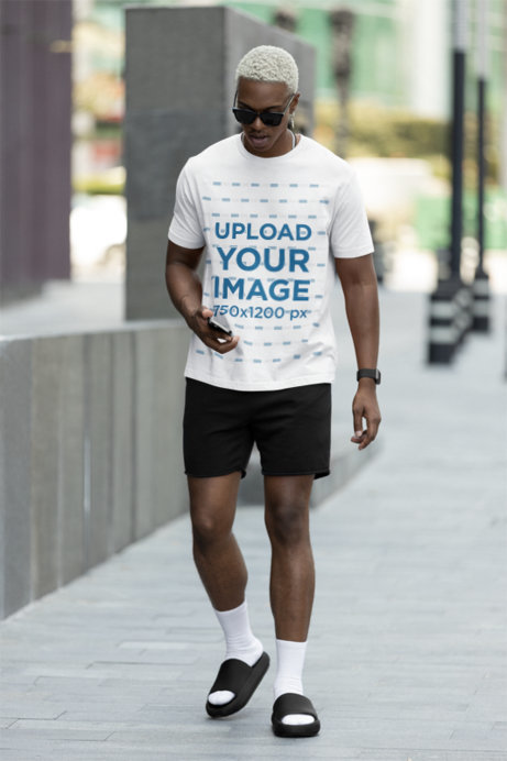 Placeit - Stanley Stella T-Shirt Mockup Featuring a Serious Man Walking ...