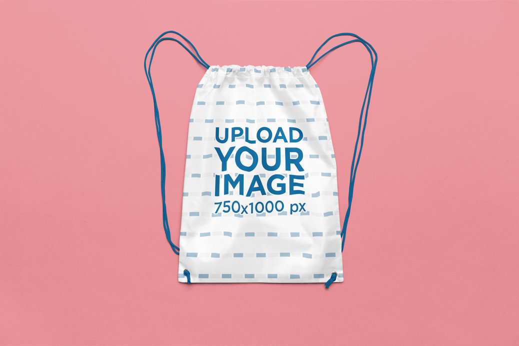 Placeit - Mockup of a Sublimated Drawstring Bag Lying on a Colorful Background