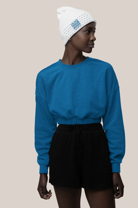 Placeit - Mockup of a Woman Wearing a Yupoong Beanie in a Studio