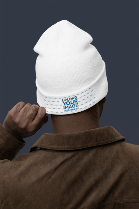 Placeit - Back-View Yupoong Beanie Mockup Featuring a Man in a Studio