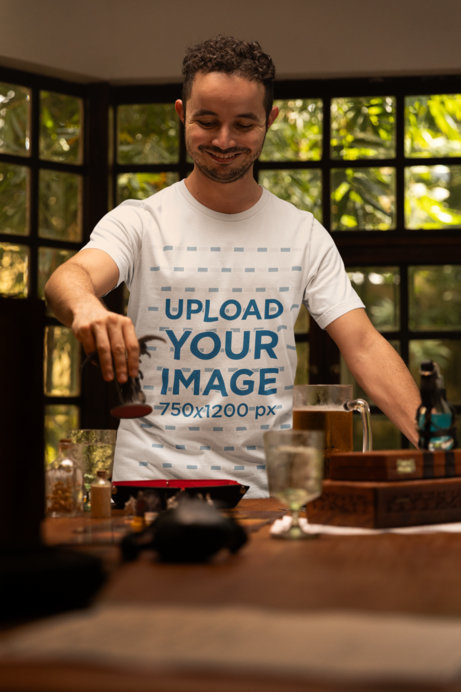 Placeit - Bella Canvas T-Shirt Mockup of a Smiling Man Holding an RPG ...