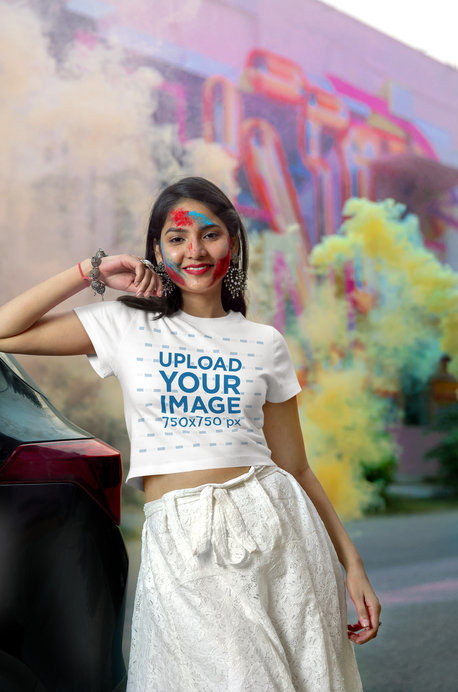 Placeit - Crop Top Mockup of a Cheerful Woman Celebrating Holi