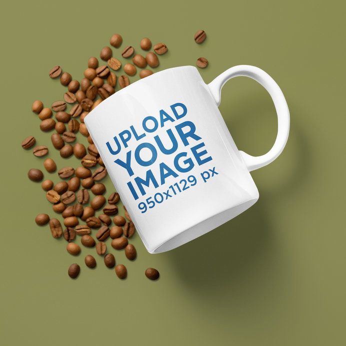 Placeit - Mockup of an 11 oz Mug Placed over Coffee Beans
