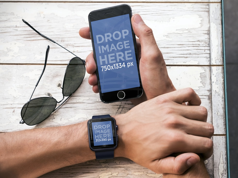 Placeit - Top Shot of Man Holding iPhone 6 and Wearing a Black Apple Watch