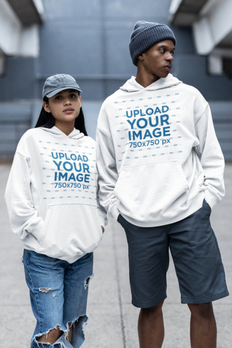 Placeit - Streetwear Mockup of a Man and a Woman Wearing Hoodies from Gildan