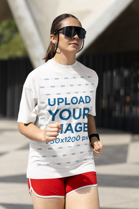 Placeit - Oversized Tee Mockup of a Fitness Woman Running in a Park