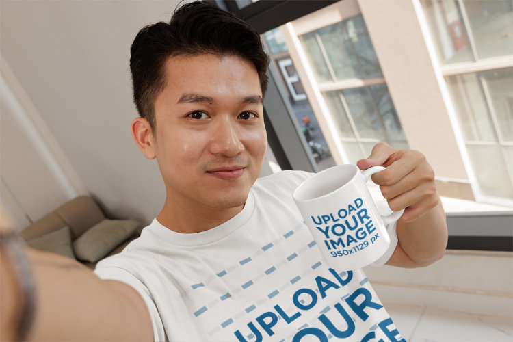 Placeit - Gildan T-Shirt Mockup of a Smiling Man Taking a Selfie With a ...