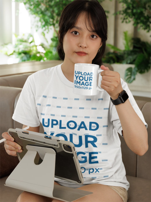Placeit - Gildan T-Shirt Mockup Featuring a Woman Holding an 11 oz Mug