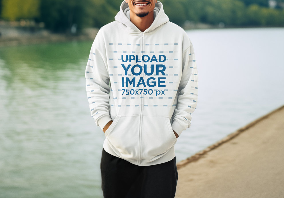 Placeit - Full-Zip Hoodie Mockup of an AI-Generated Man Standing in Front of a Lake