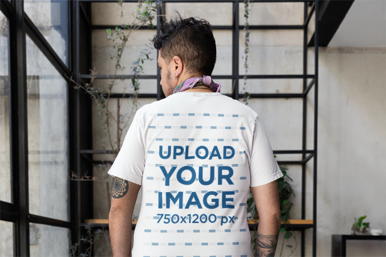 Placeit - Back-View T-Shirt Mockup Featuring a Person with Arm Tattoos