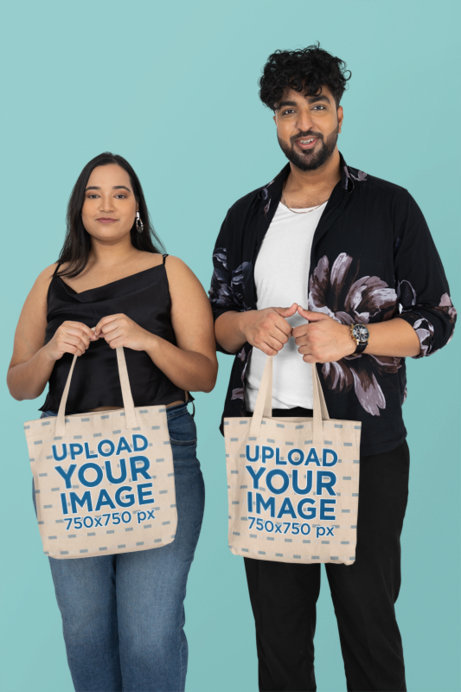 Placeit - Mockup of a Man and a Woman Holding Matching Tote Bags in a ...