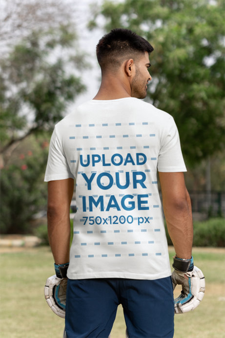 Placeit - Back-View T-Shirt Mockup of a Man Standing at a Cricket Field