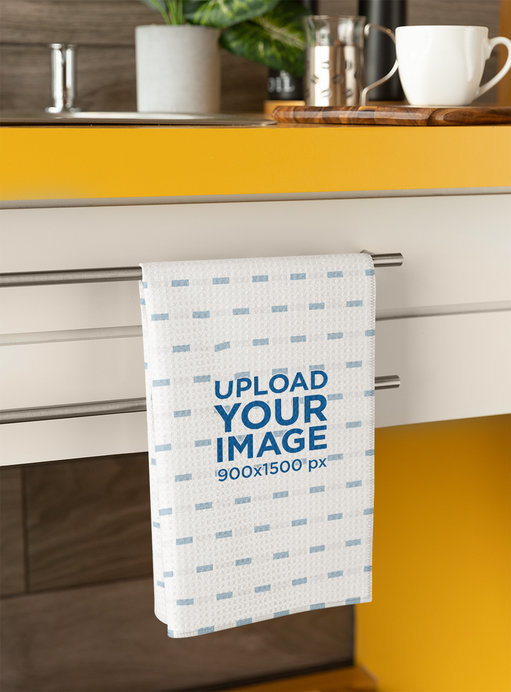 Placeit - Mockup of a Microfiber Tea Towel Hanging From a Kitchen Drawer
