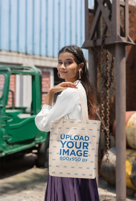 Placeit - Gen Z Mockup Featuring a Smiling Woman Carrying a Tote Bag