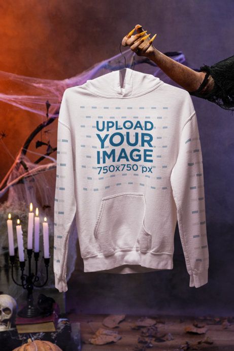 Placeit - Mockup of a Scary Monster Hand Holding a Gildan Hoodie in a ...