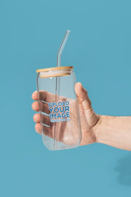 Placeit - Drinkware Mockup Featuring a Man Holding an Empty Sipper Can ...