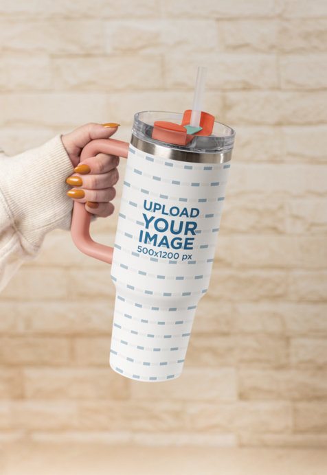 Placeit - Stanley Mockup Featuring a Woman's Hand Holding a Tumbler