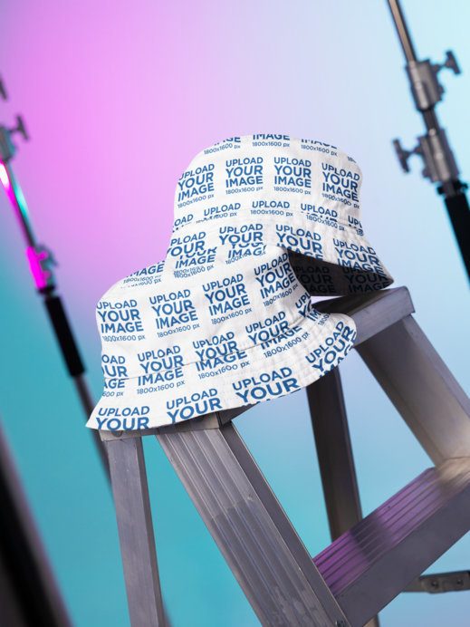 Placeit - Sublimated Mockup Featuring Two Bucket Hats Placed on a Ladder