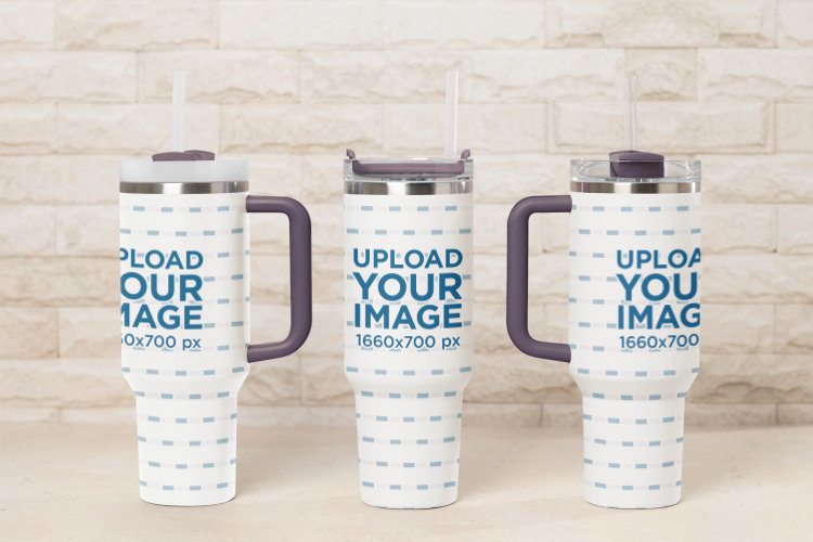 Placeit - Mockup of Three Stanley Tumblers Placed Against a Brick Wall