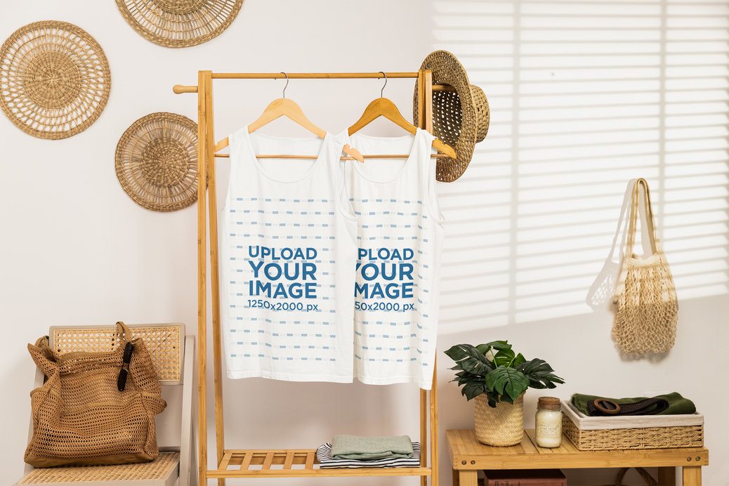 Placeit - Comfort Colors Mockup of Two Tank Tops Placed on a Wooden Closet