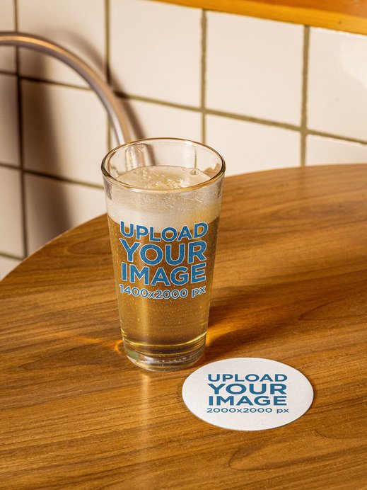 Placeit - Shaker Pint Beer Glass Mockup Featuring a Coaster Placed on a ...