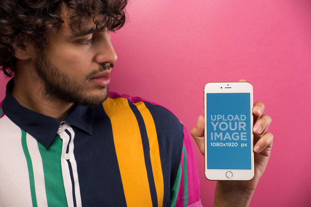 Placeit - Mockup of a Man Wearing a Vintage Shirt Holding an iPhone ...
