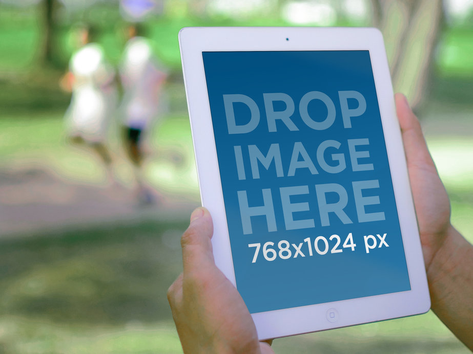 Placeit - Mockup of a White iPad Featuring Joggers in the Background