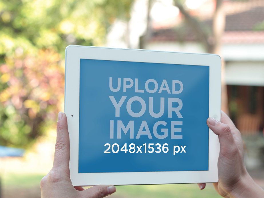 Placeit - Mockup of a White iPad in The Sun