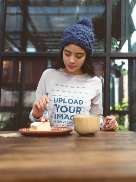 Placeit - Sweatshirt Mockup of a Woman Eating Cake