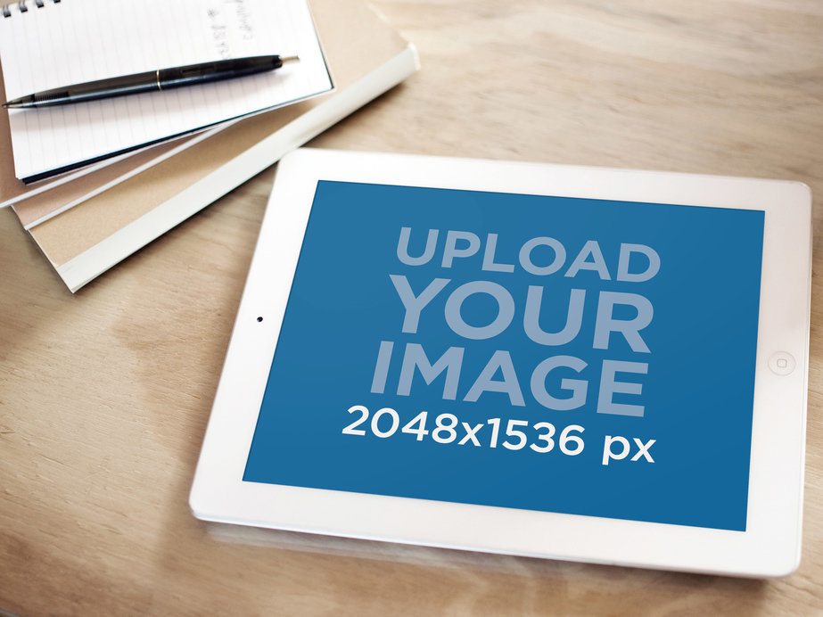 Placeit - Mockup of an iPad on a Wooden Table with Notebook