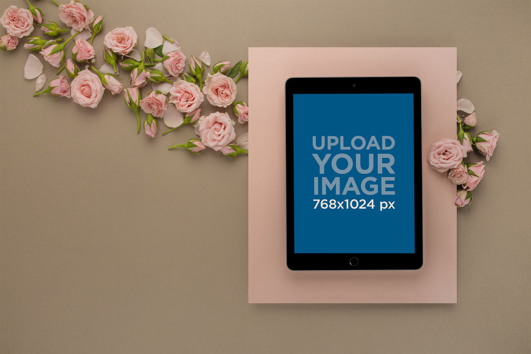 Placeit - iPad Mockup Over a Taupe Background with Roses