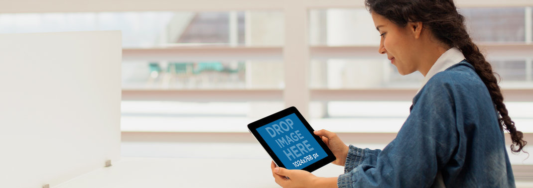 Placeit - Tablet Mockup of Girl Using Black iPad at School
