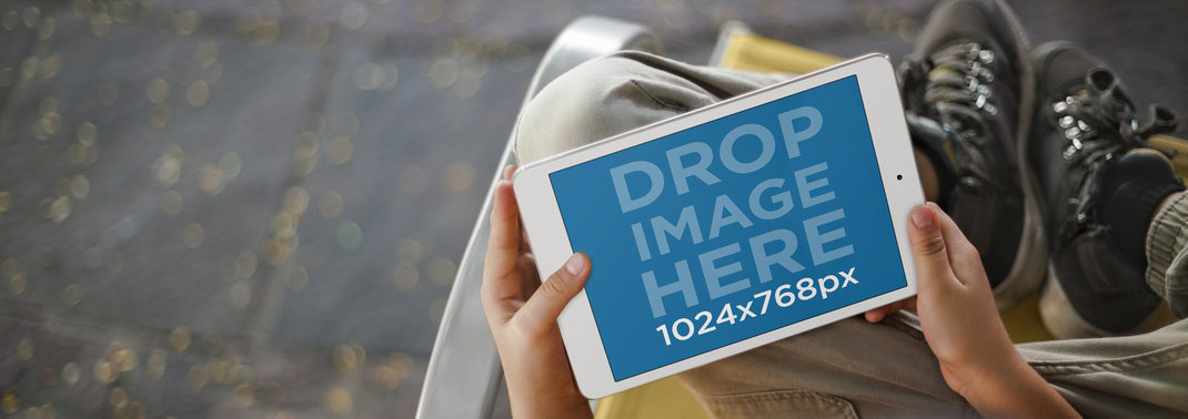 Placeit - Tablet Mockup Featuring a Kid Using a White iPad