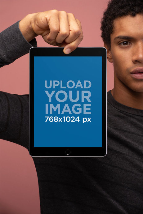 Placeit - Mockup of a Man Holding his iPad from the Top