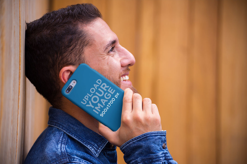 Placeit - Phone Case Mockup Featuring a Smiling Man Talking on the Phone