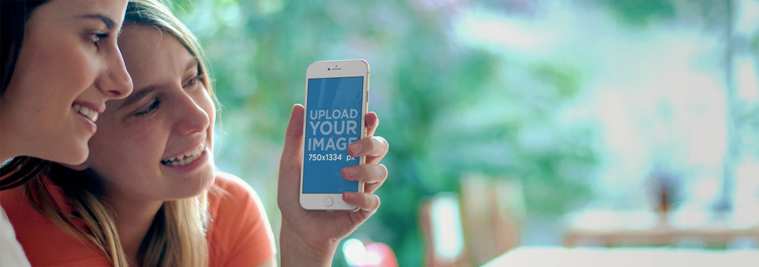 Placeit - iPhone 6 Mockup of Two Best Friends Eating Out