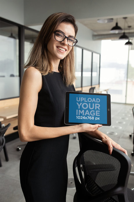 Placeit - Mockup of a Smiling Office Woman Holding an iPad in Landscape ...