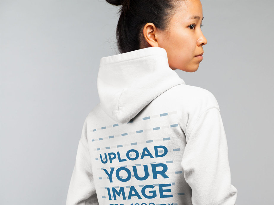 Placeit - Pullover Hoodie Mockup of a Serious Woman in a Studio