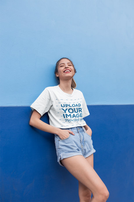 Placeit - Mockup of a Smiling Woman Wearing a Round Neck Tee Leaning ...