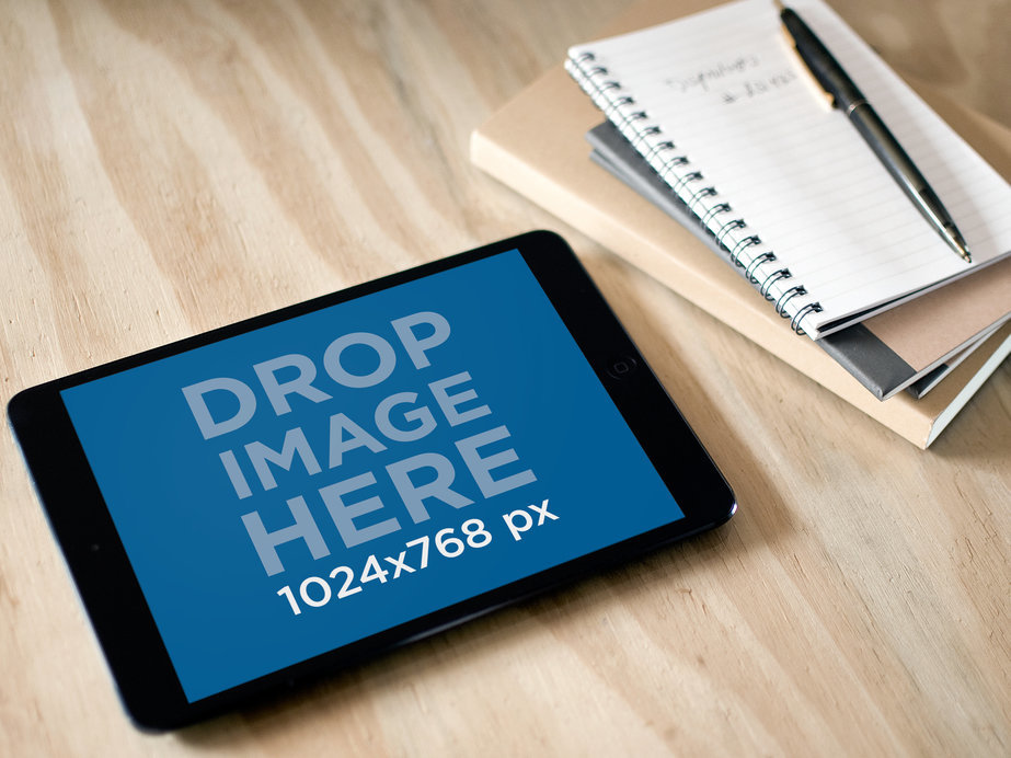 Placeit - Mockups of a Black iPad Featuring Some Notebooks