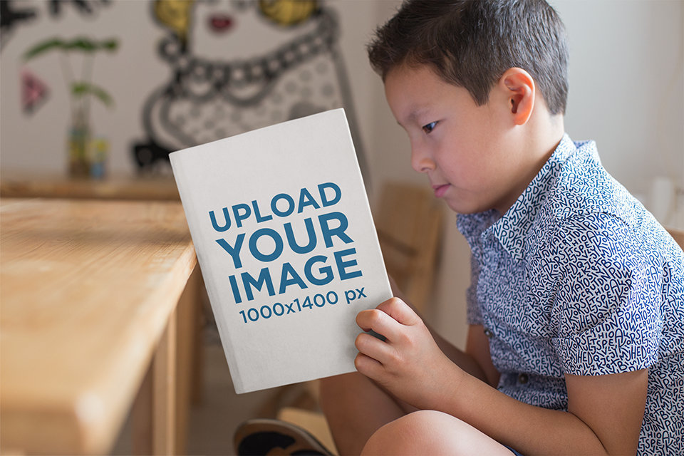 Placeit - Back to School Book Mockup of a Little Kid Reading
